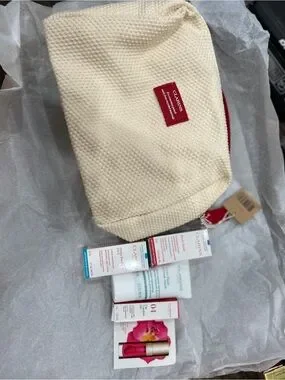 Clarins | Skincare | Clarins Cream Textured Cosmetic Pouch With Red ...